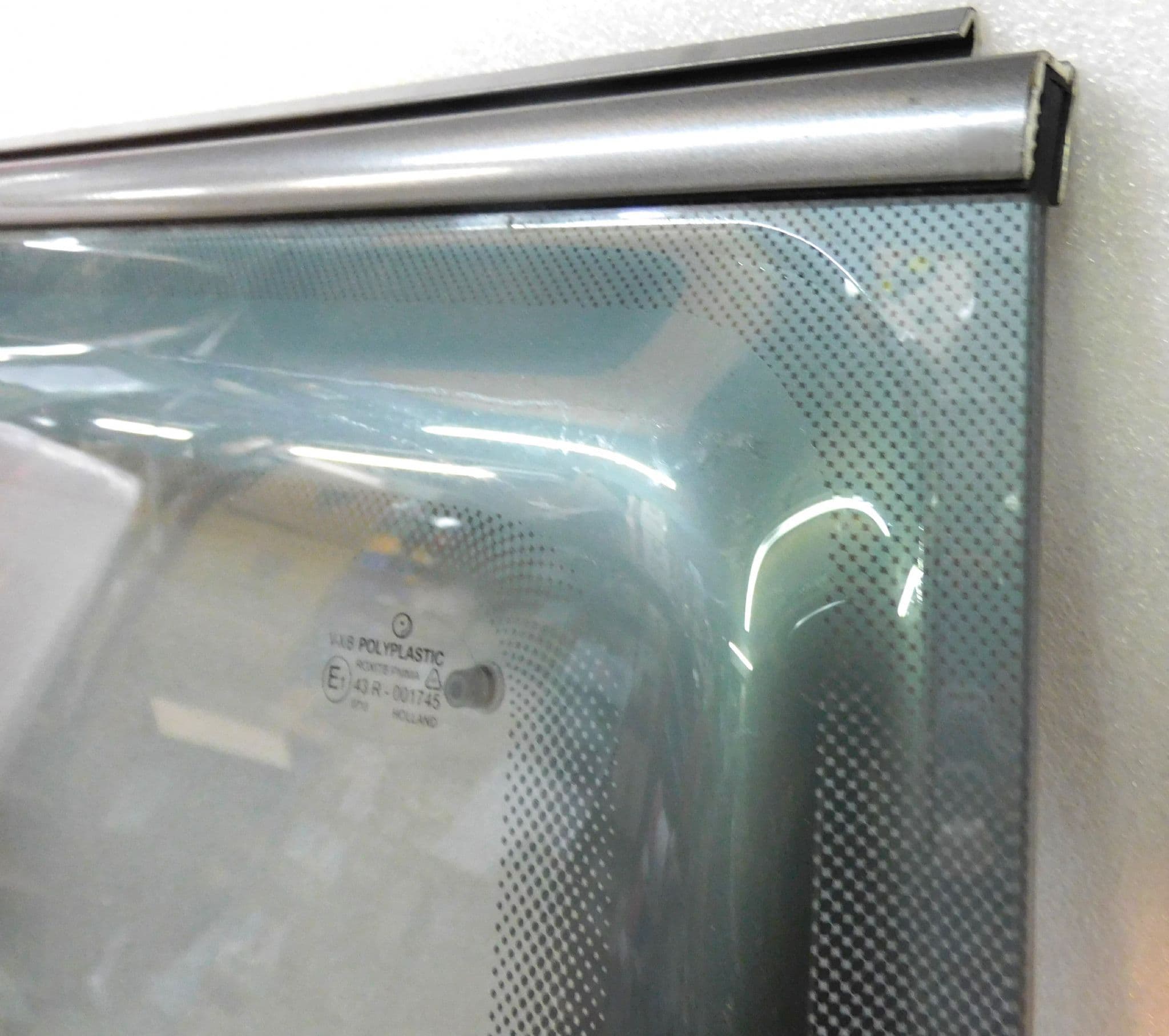 CARAVAN front L/H side Polyplastic window