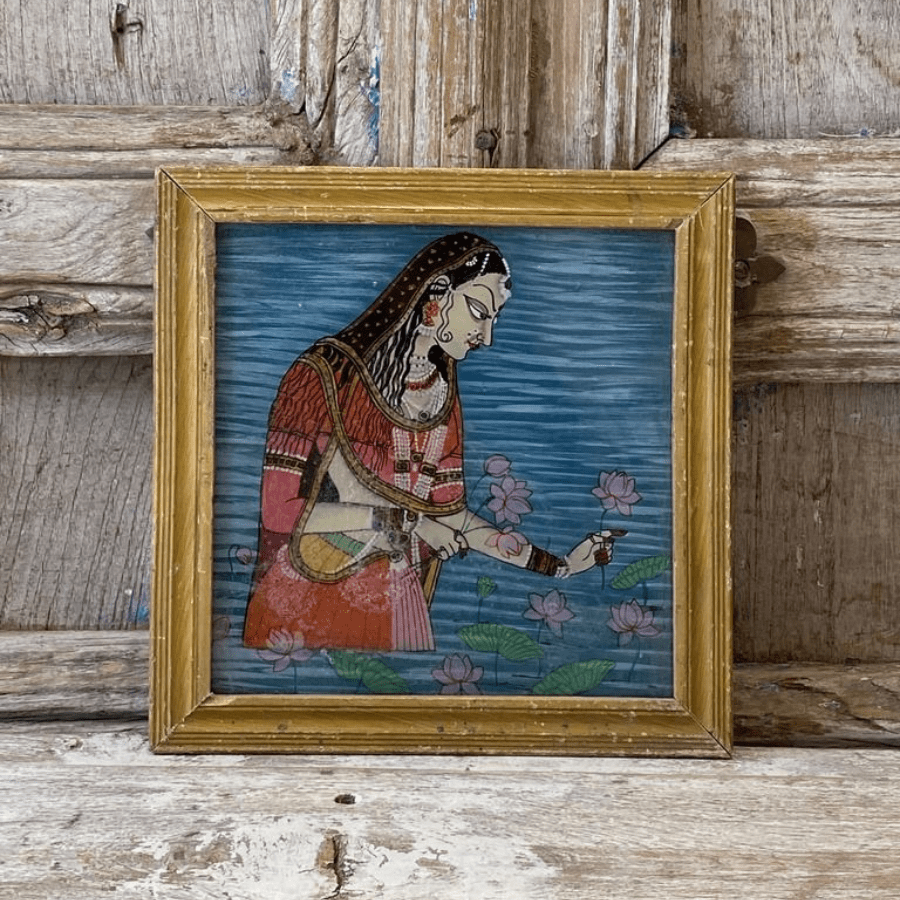 Glass painting of a rajasthani princess and lotus flowers
