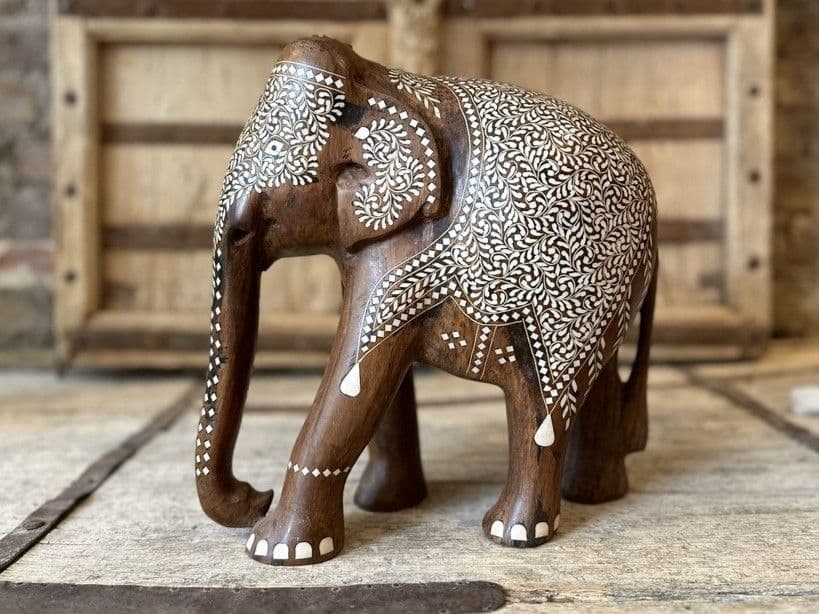hand carved teak elephant with bone inlay