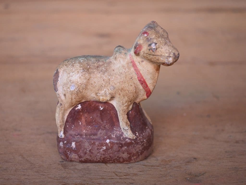 Old clay Nandi with faded paint