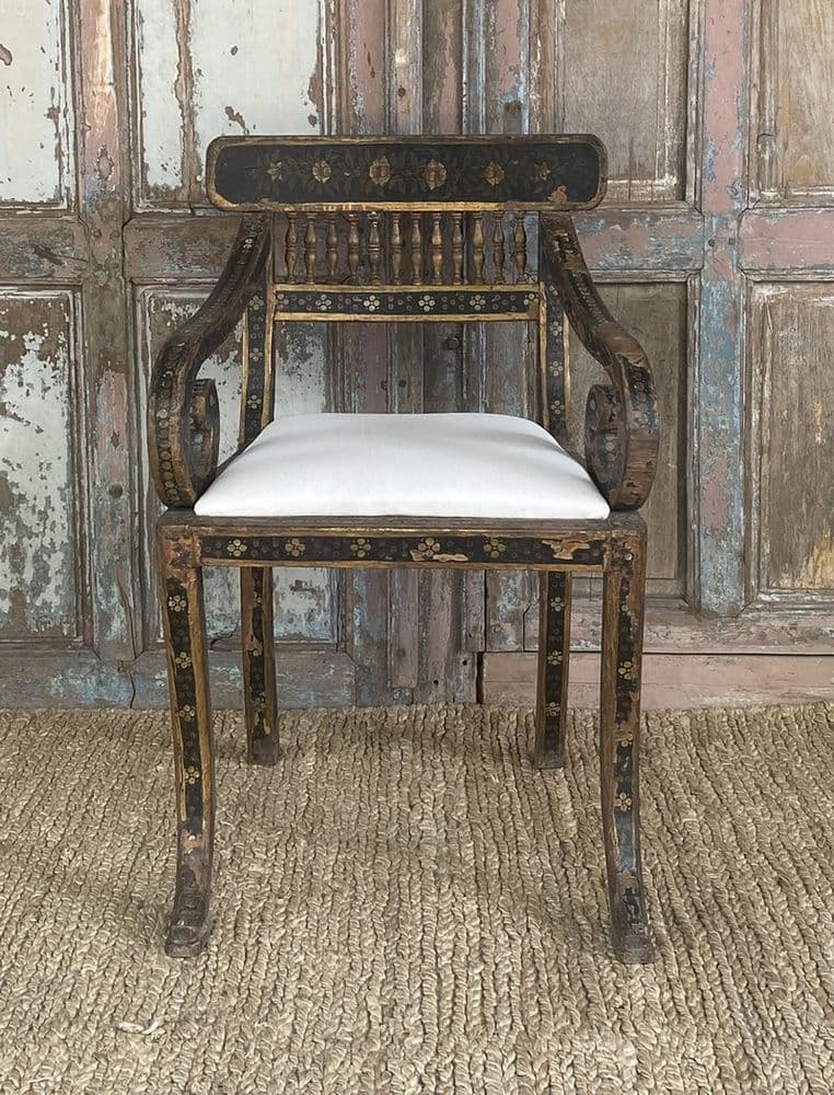 Teak colonial carver chair with polychrome paint tones