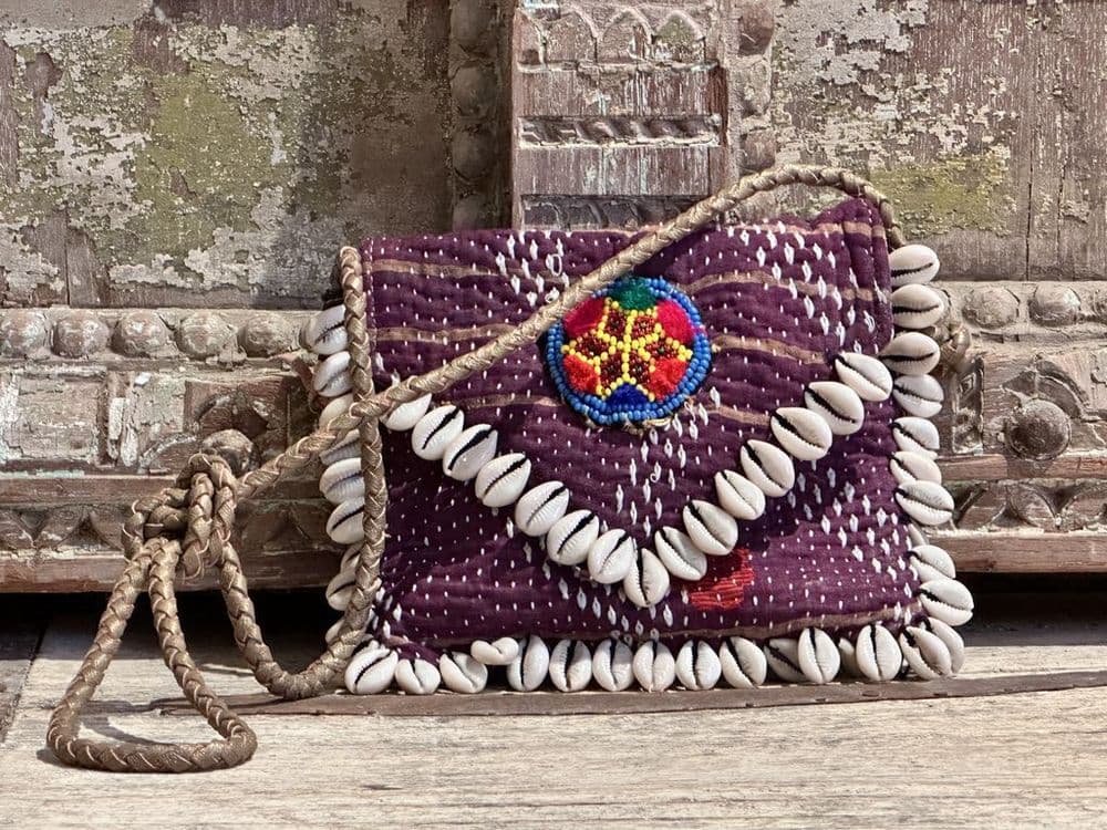 Vintage textiles bag with cowrie shells