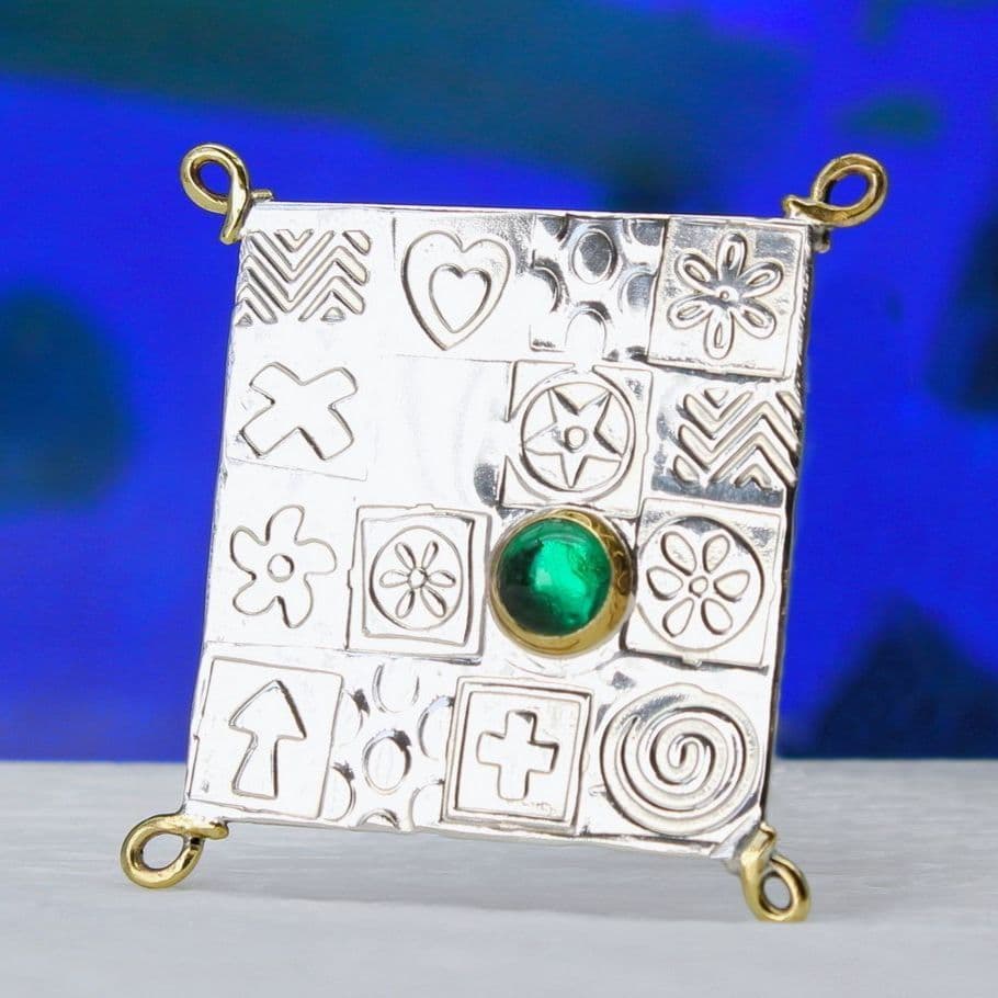 Handmade square sterling silver brooch featuring a green spinel gemstone