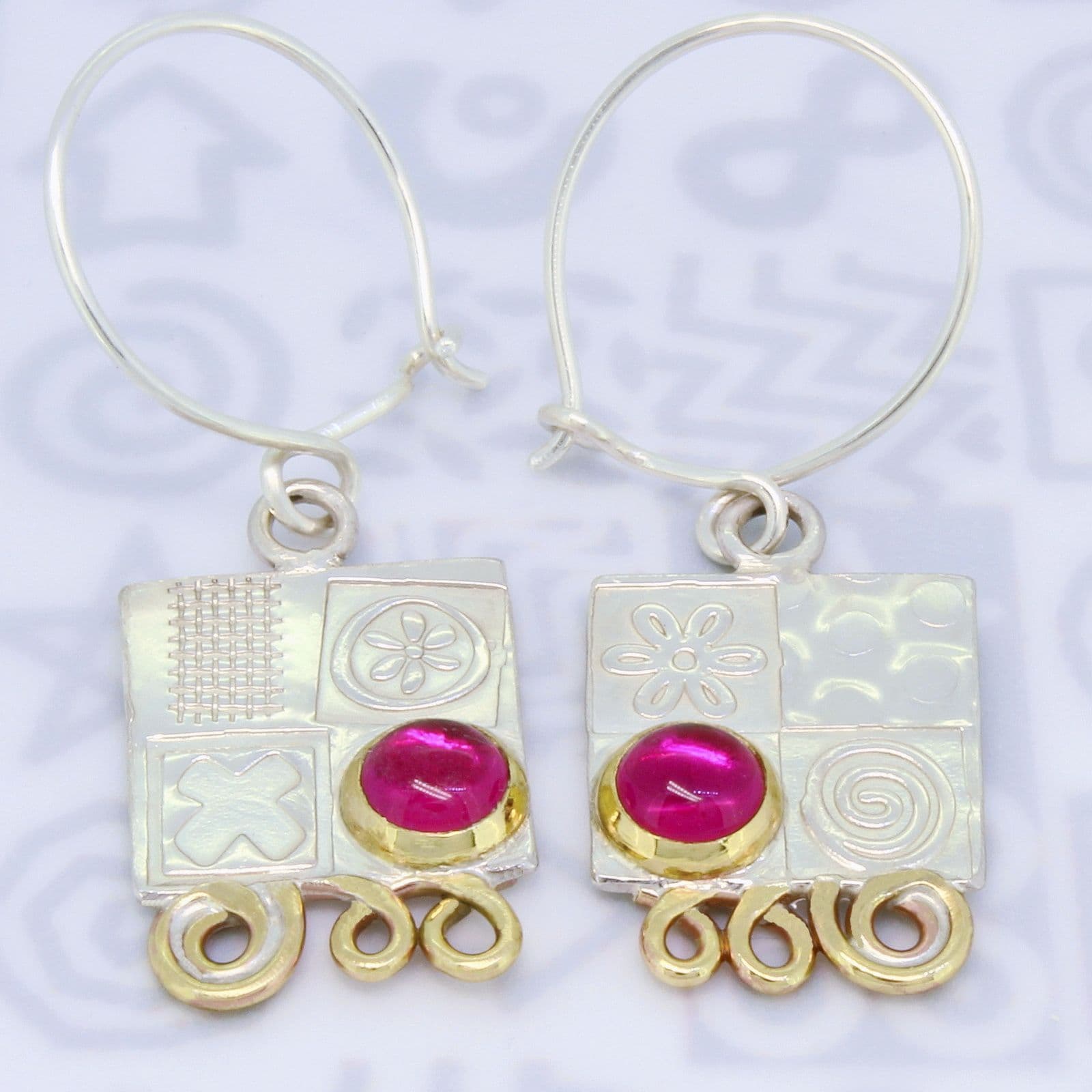 Matching small silver earrings featuring green spinel gemstones