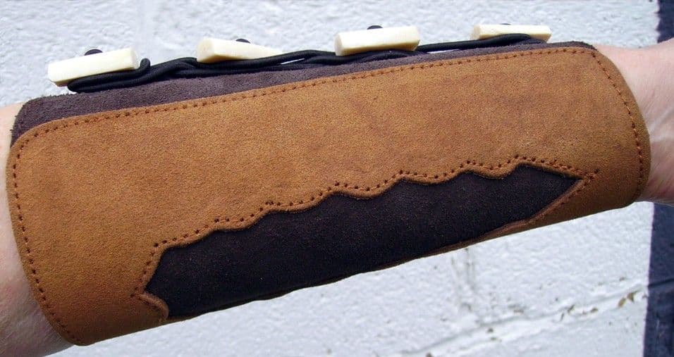 BROWN BRACER bone button fastening