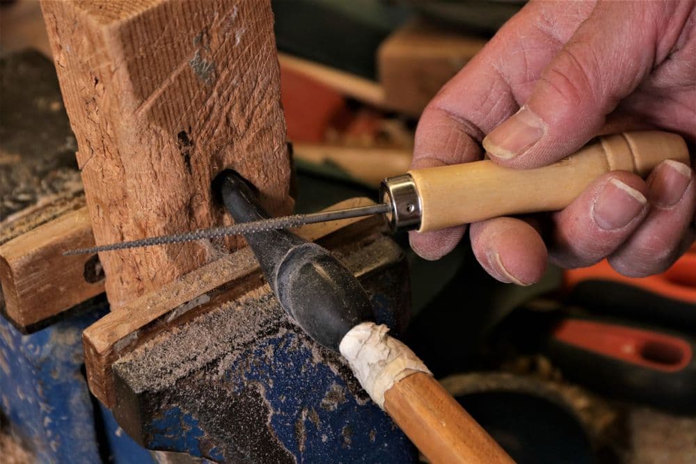 Rat tail rasp tool for nock grooves