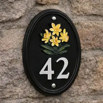 Black Oval Cast House Number Sign with Motif | The Sign Maker Shop