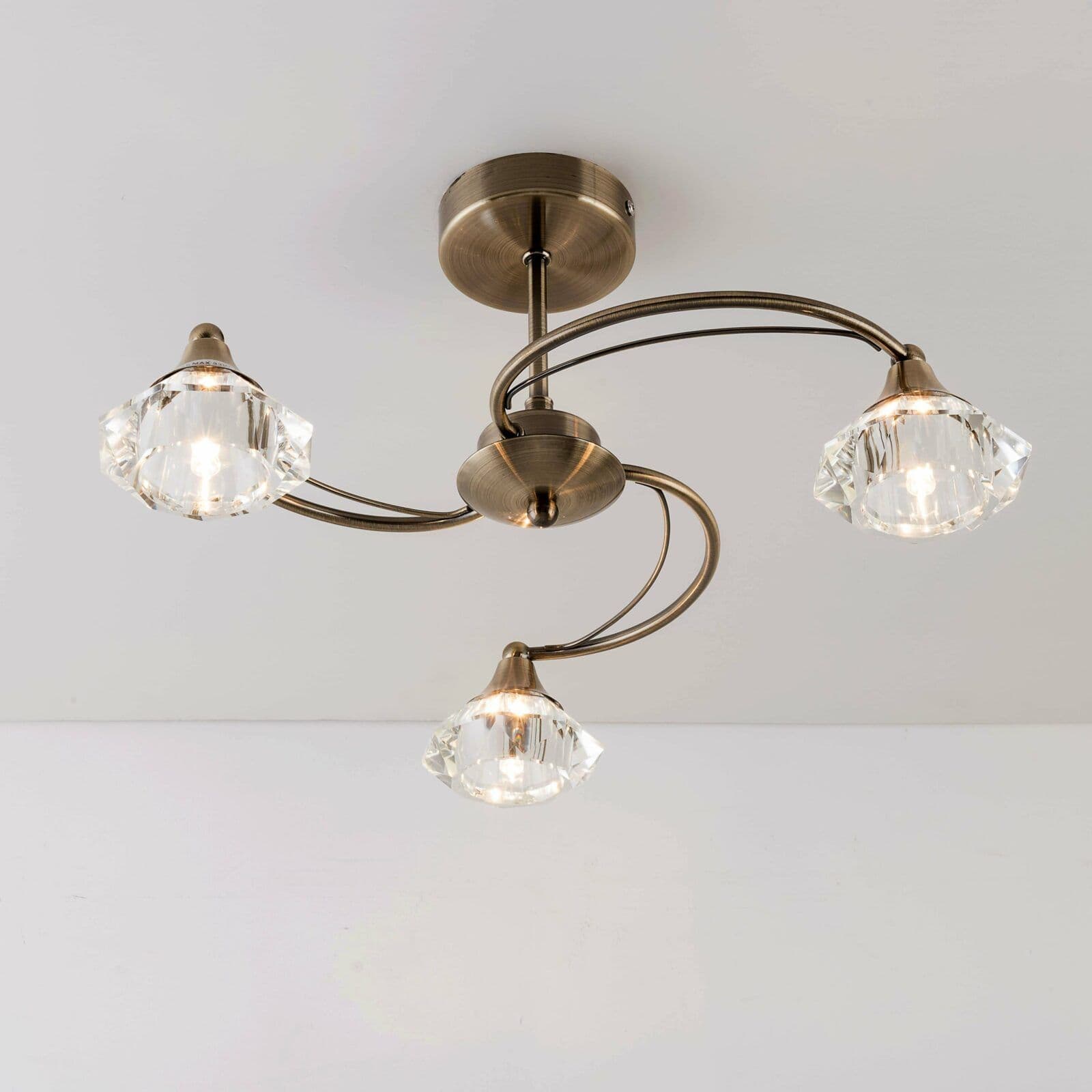 Radford 3 Light Fitting in an Antique Brass Finish with Clear Glass Shades