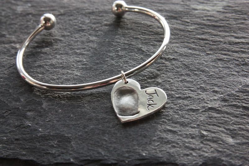 Sterling silver torque bangle with regular fingerprint charm