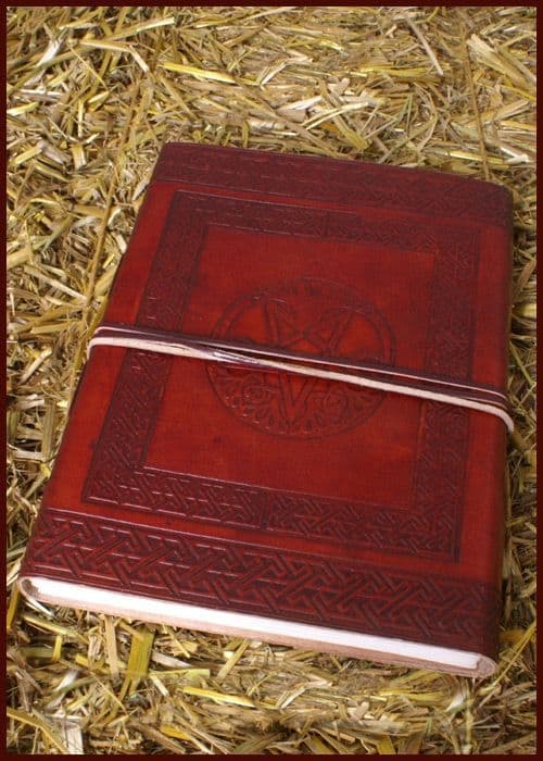 Large leather book with a pentagram