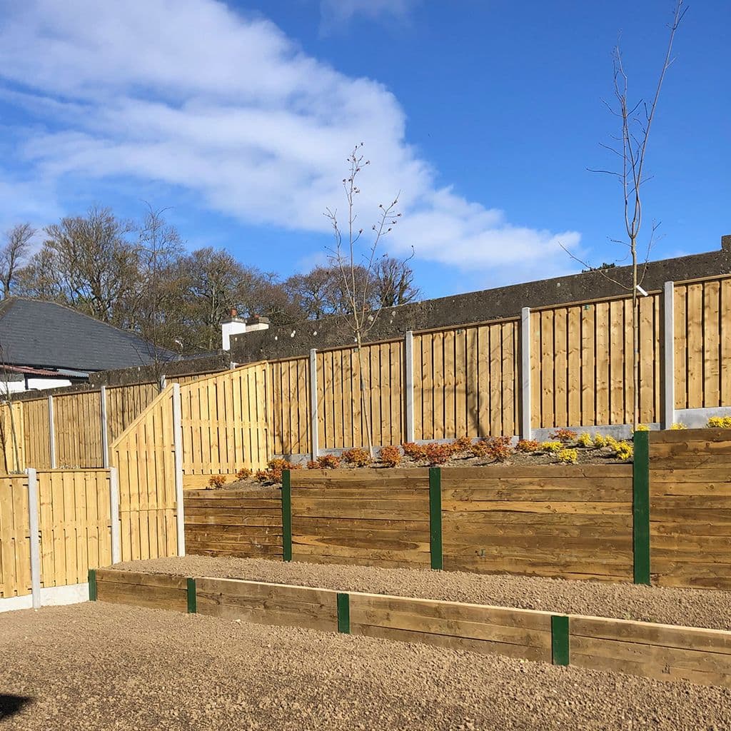 Sloped Yard Using Landscape Timbers How To Install A Fence On A Slope